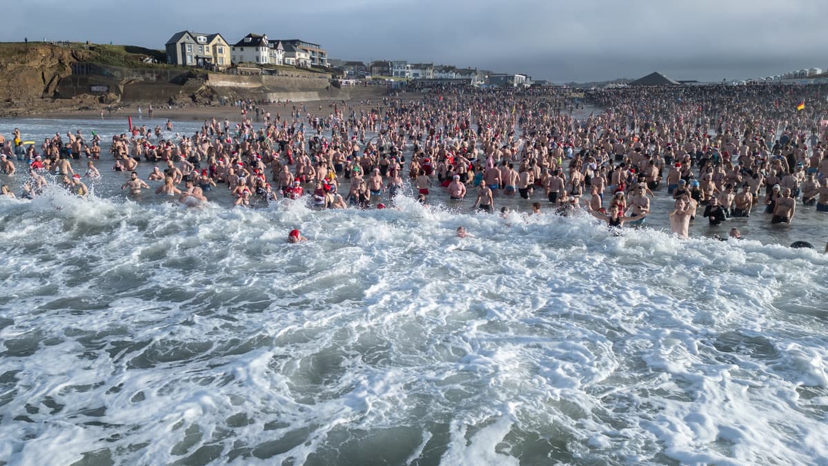Thousands raised as hundreds brave the beach in iconic Bude tradition ...